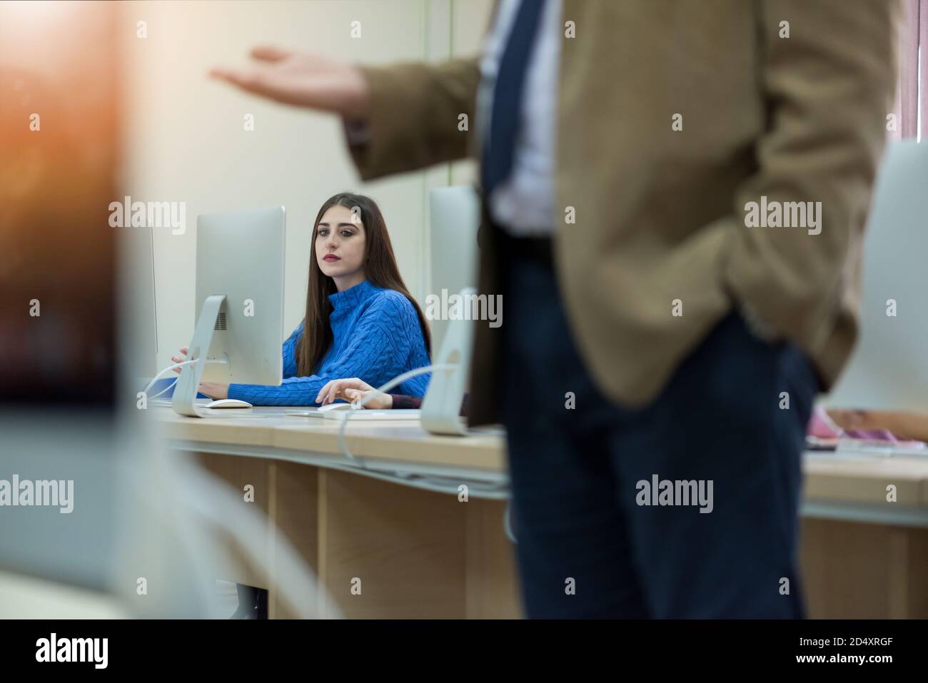 Selective focus on teacher while teaching and explaining lessons to ...