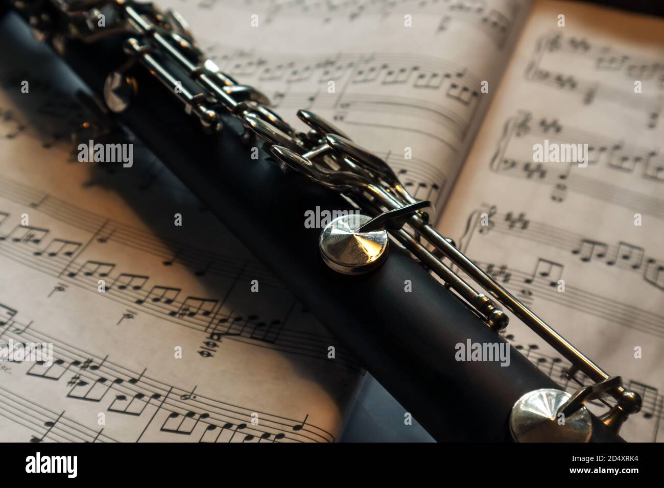 close up detailed shot of a section of a clarinet on sheet music Stock ...