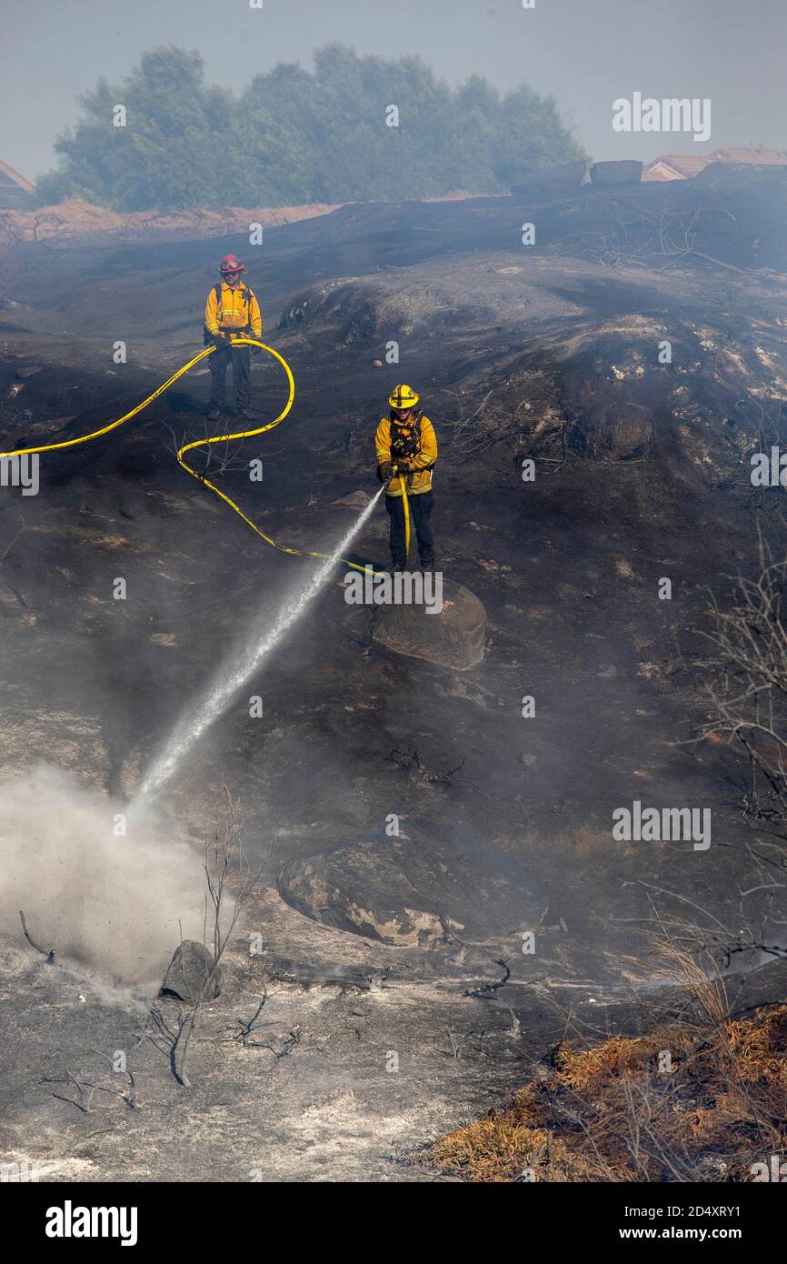 Firefighters with the Camp Pendleton Fire Department work together to ...