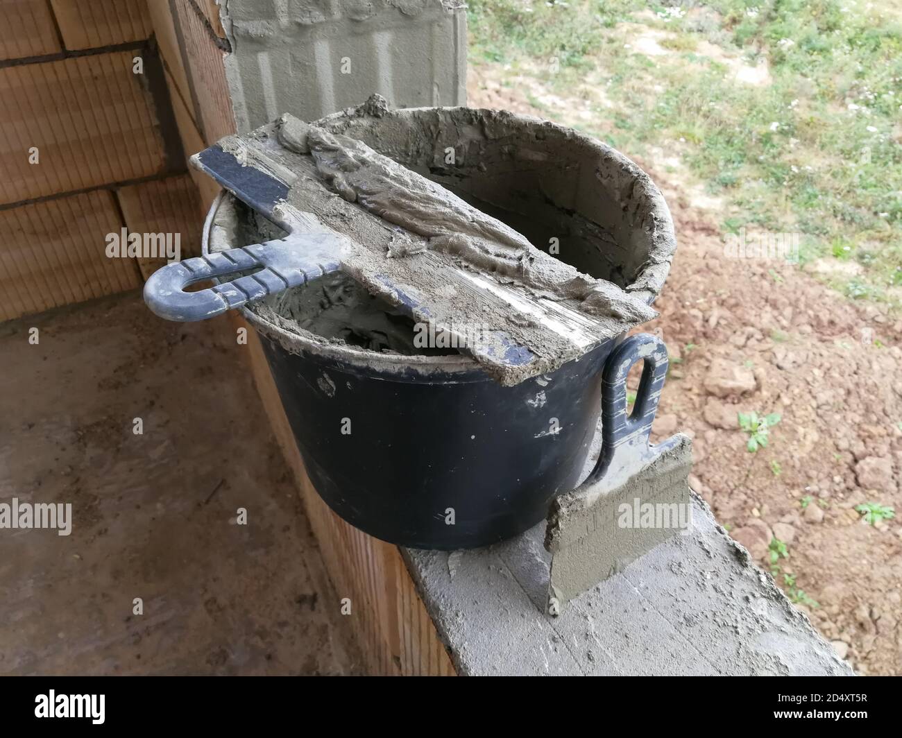 Taping knifes and cement bucket(construction work tools) for ...