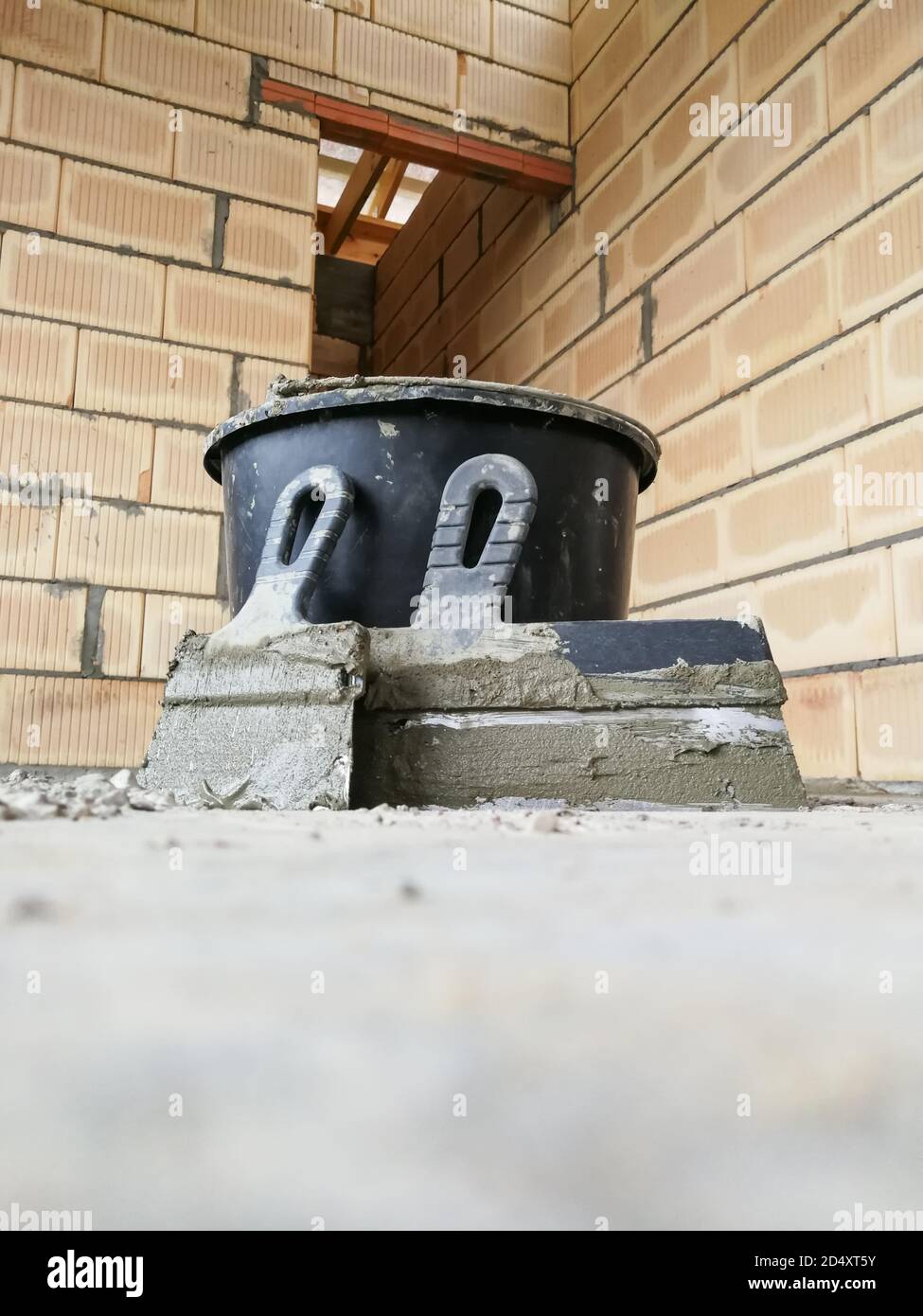 Taping knifes and cement bucket(construction work tools) for ...