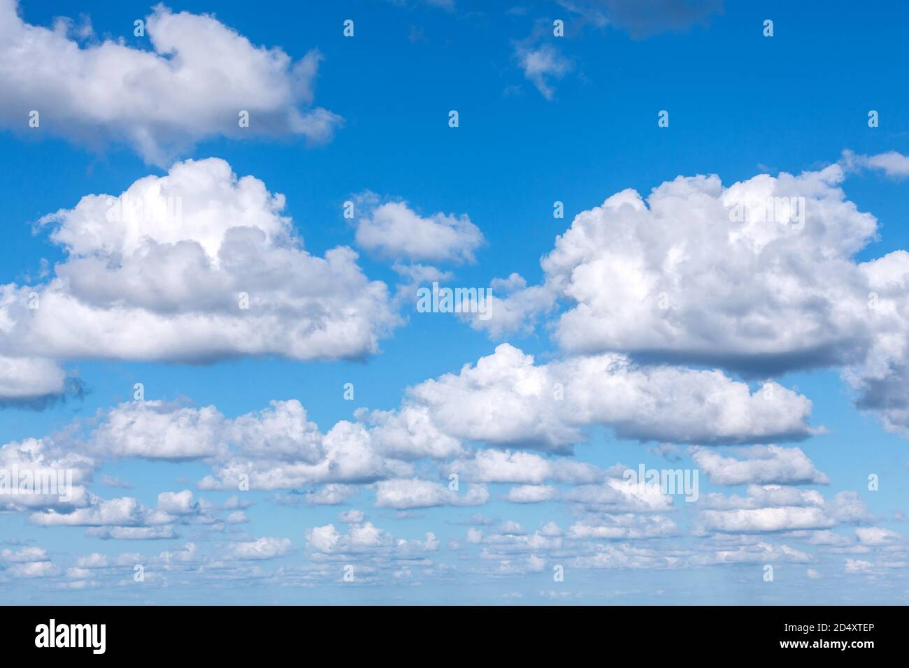 Blue sky background with cumulus clouds Stock Photo - Alamy