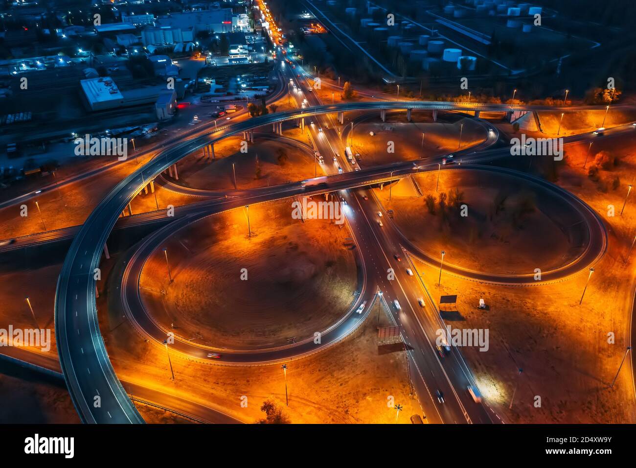 Intersection circle transport junction at night city road with car ...