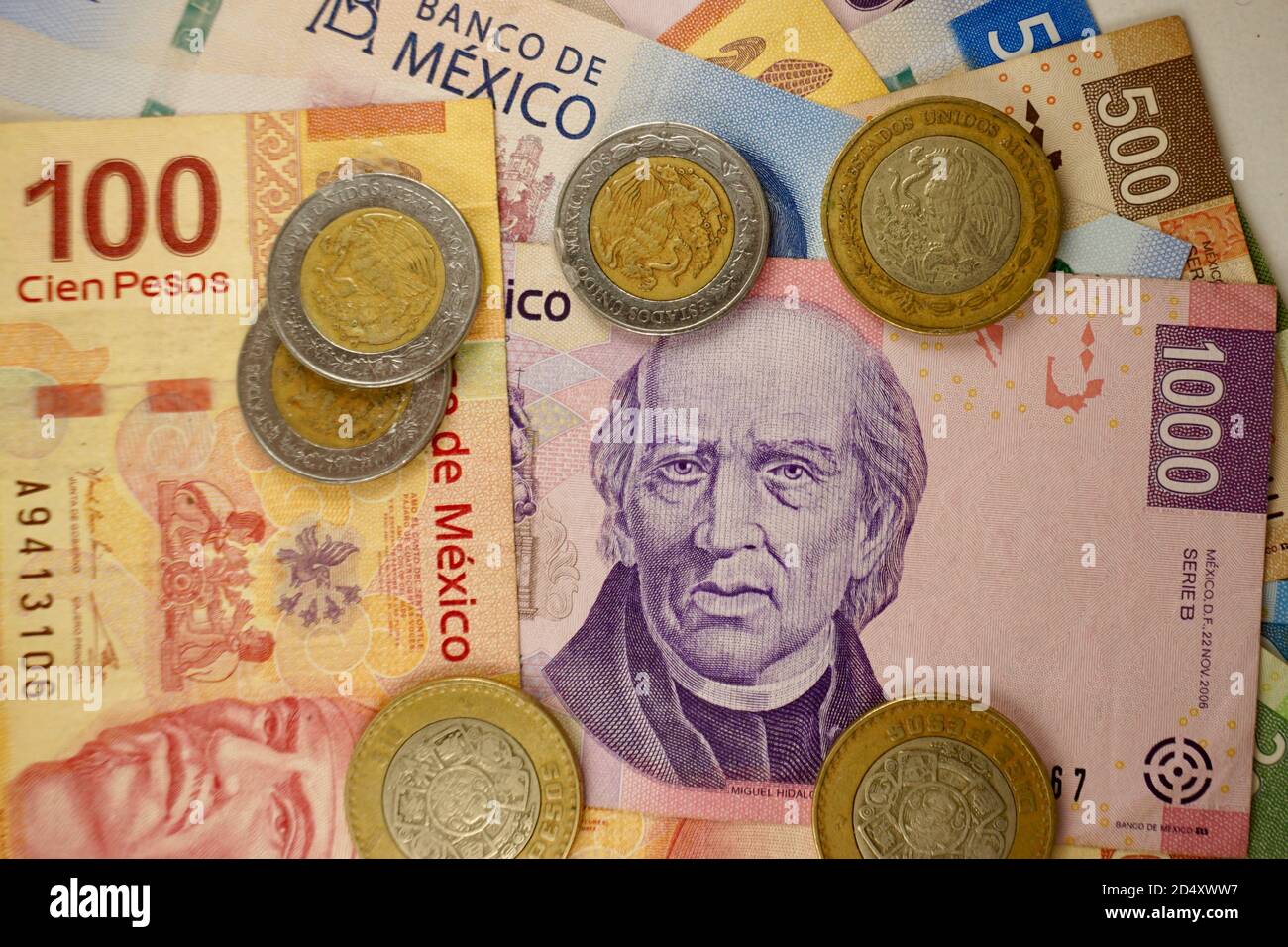 Many mexican pesos bills spread randomly over a flat surface Stock ...