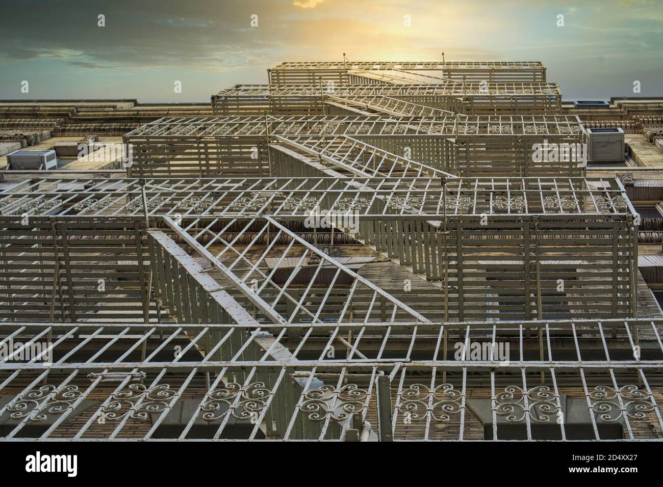 Fire escape stairs mounted to the outside of the buildings, used for ...