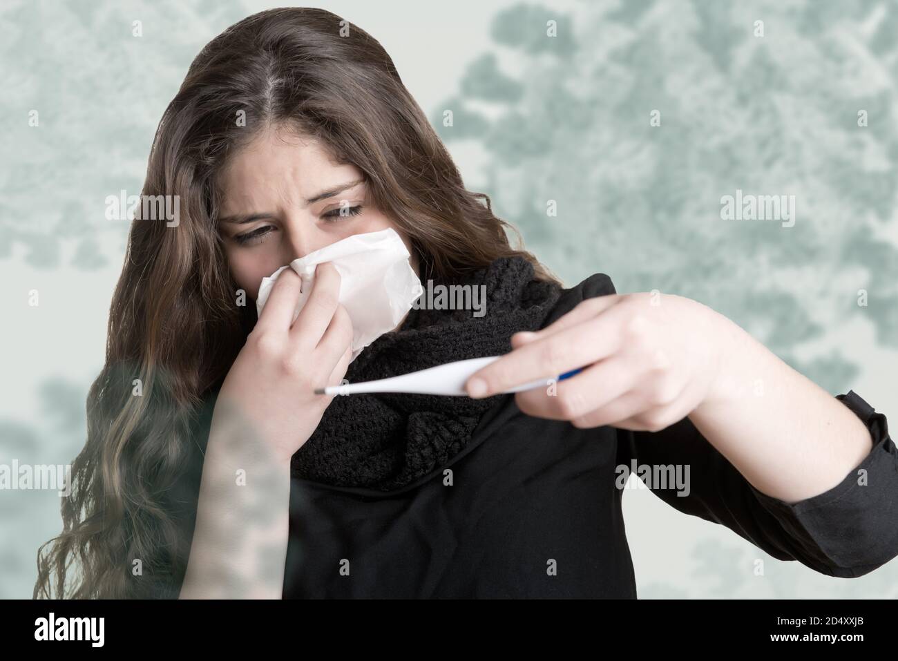 Pale sick woman with a flu checking if she has a fever with a ...