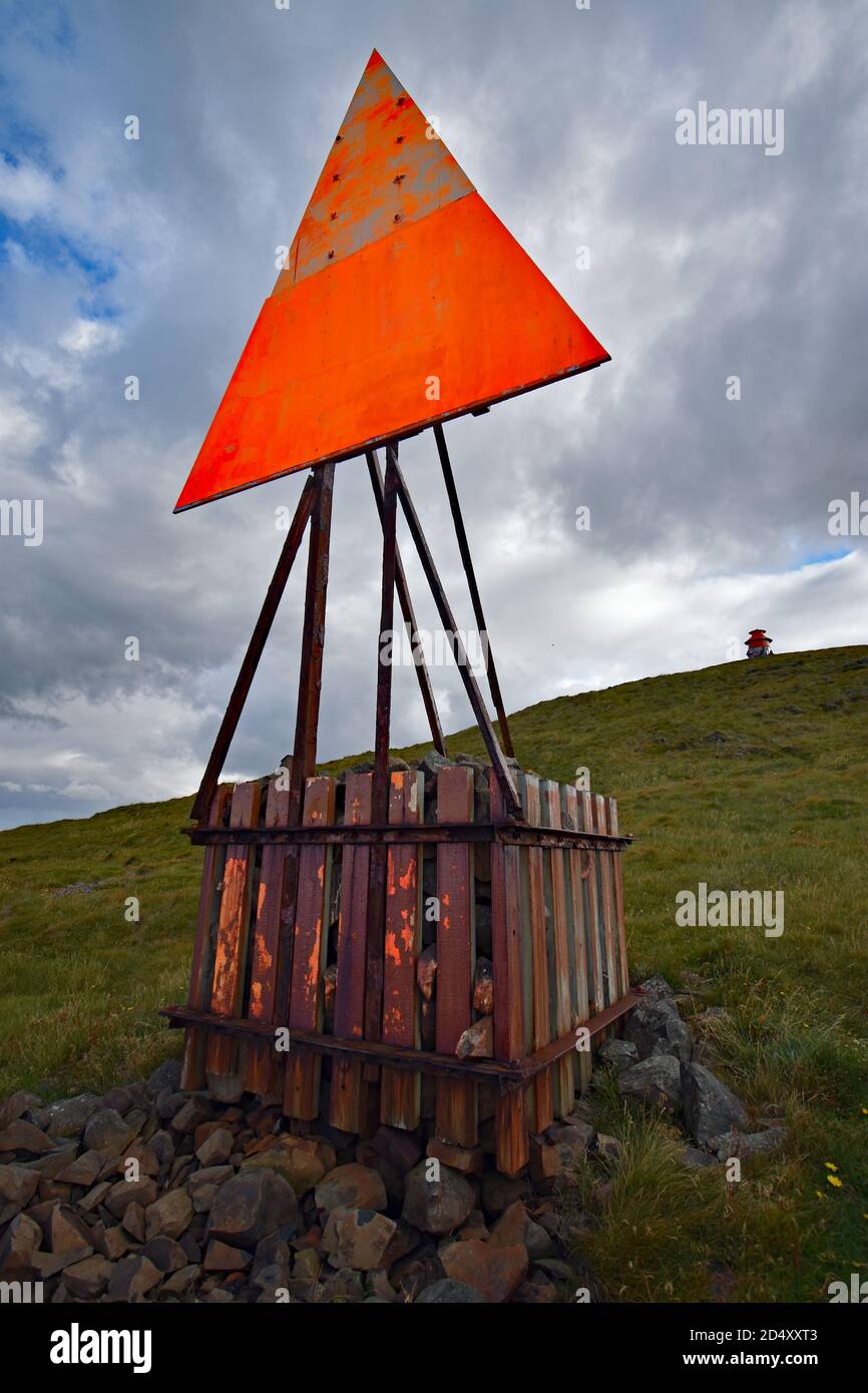 A fluorescent orange warning triangle for shipping and the Súgandisey ...