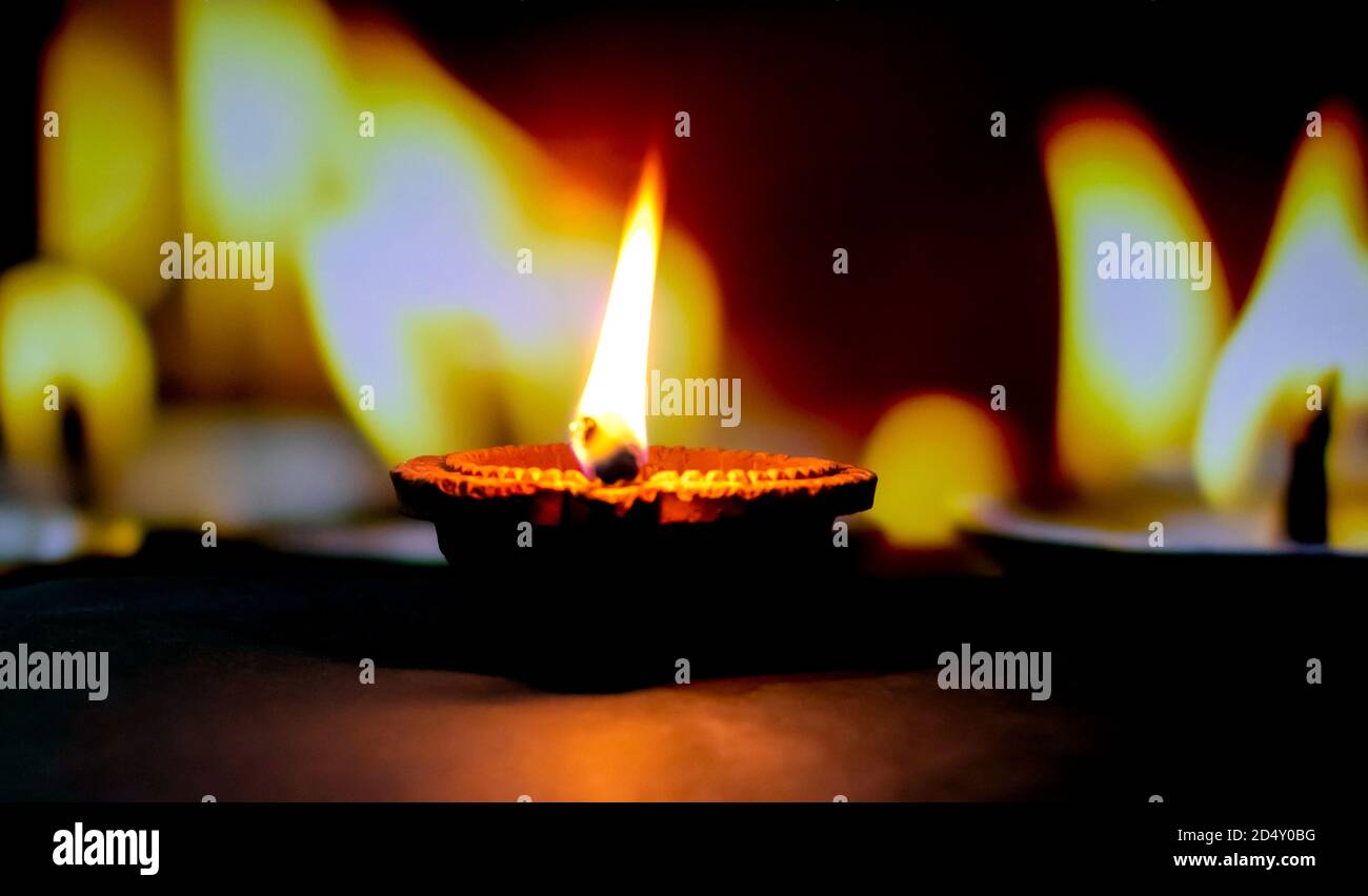Happy Diwali. Clay diya candle illuminated in Dipavali, Hindu festival ...