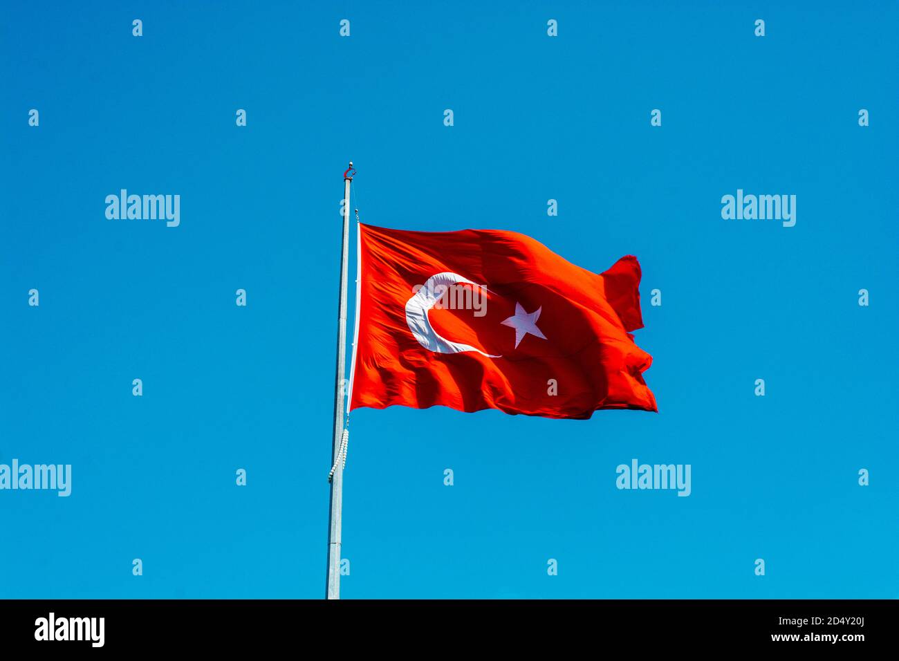 Turkish national flag with white star and moon on a pole in sky Stock ...