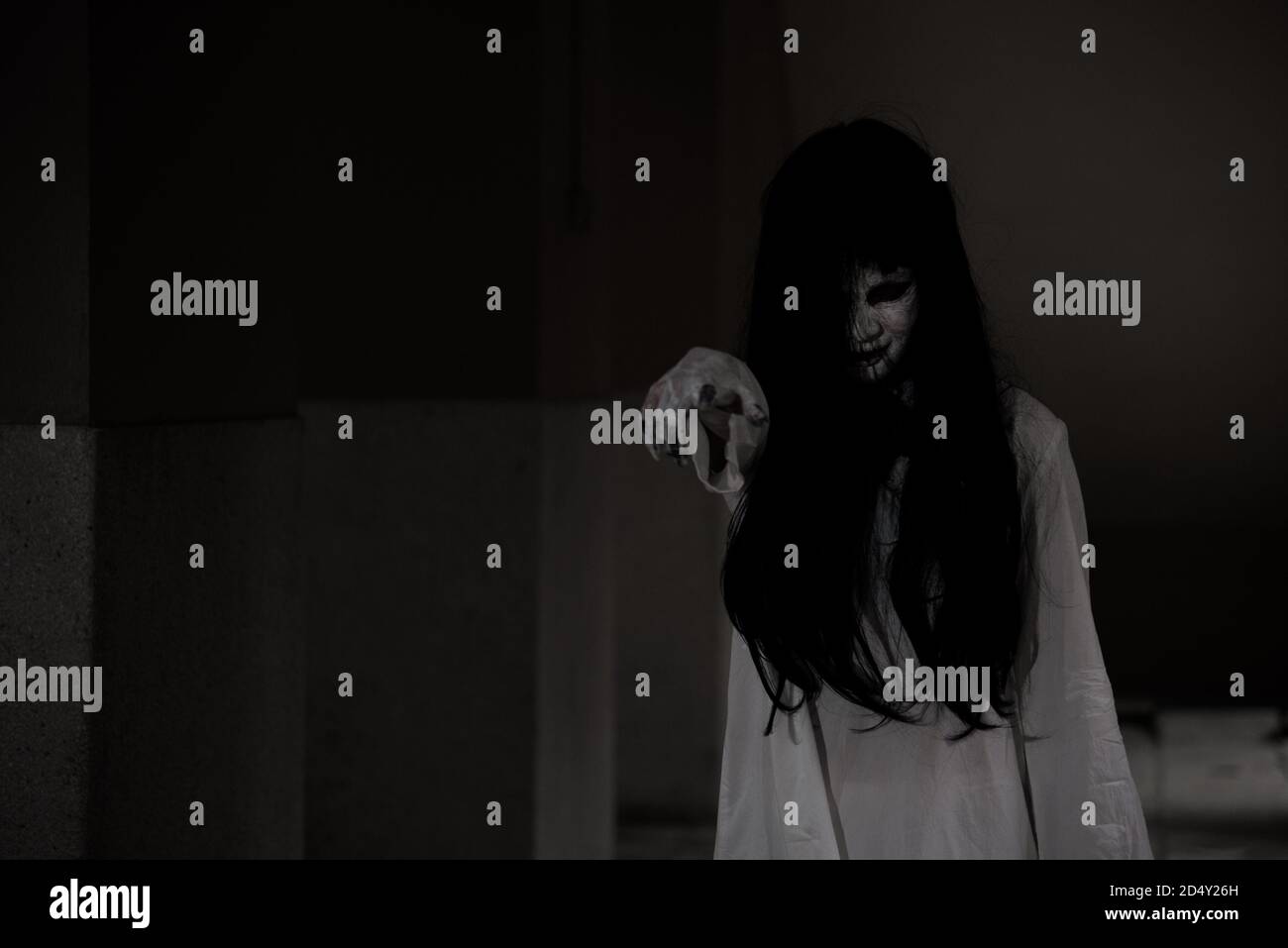 Horror woman ghost creepy standing showing hand at house, halloween day ...