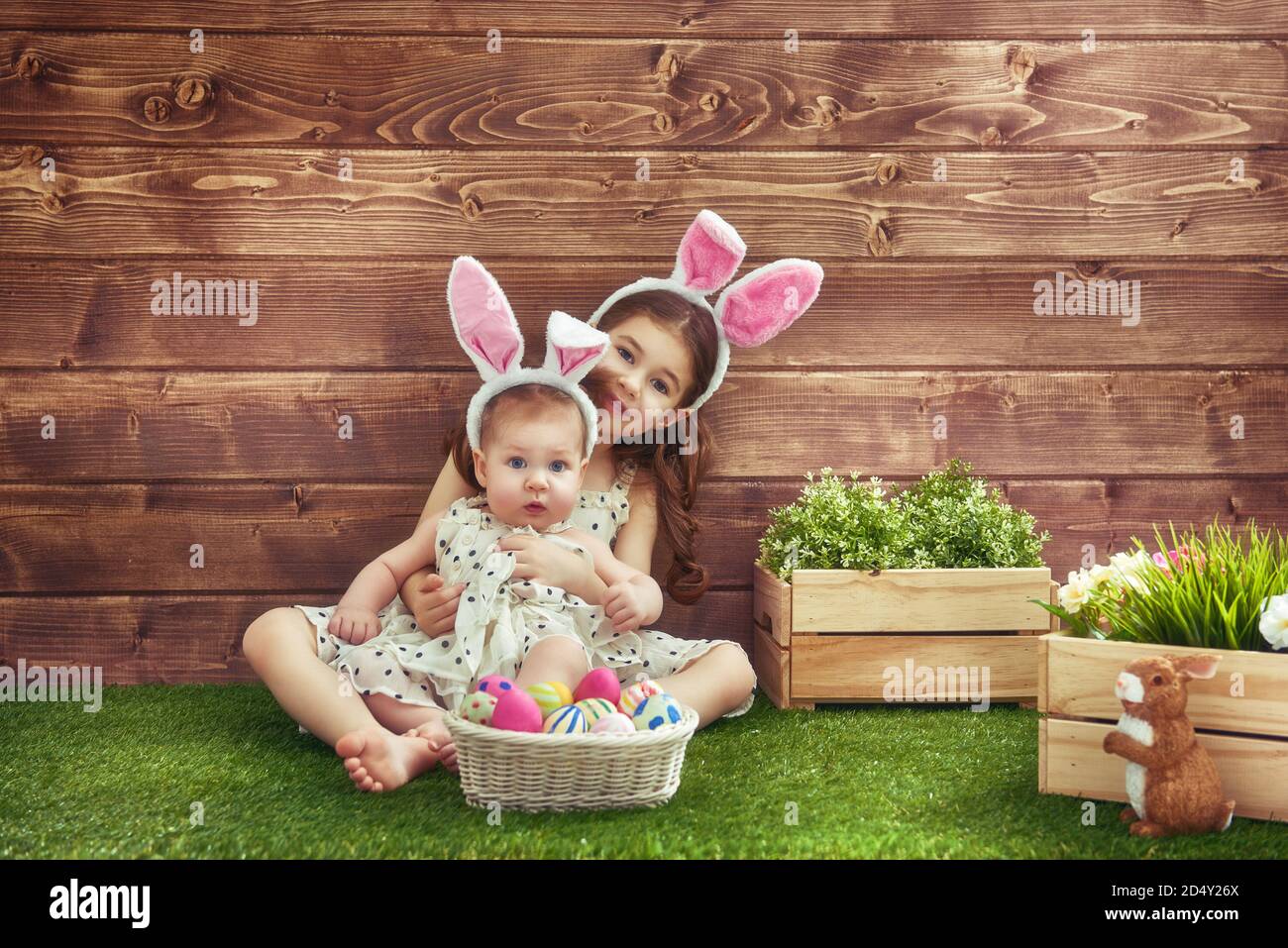 Happy Easter! Cute little children girls wearing bunny ears on Easter ...