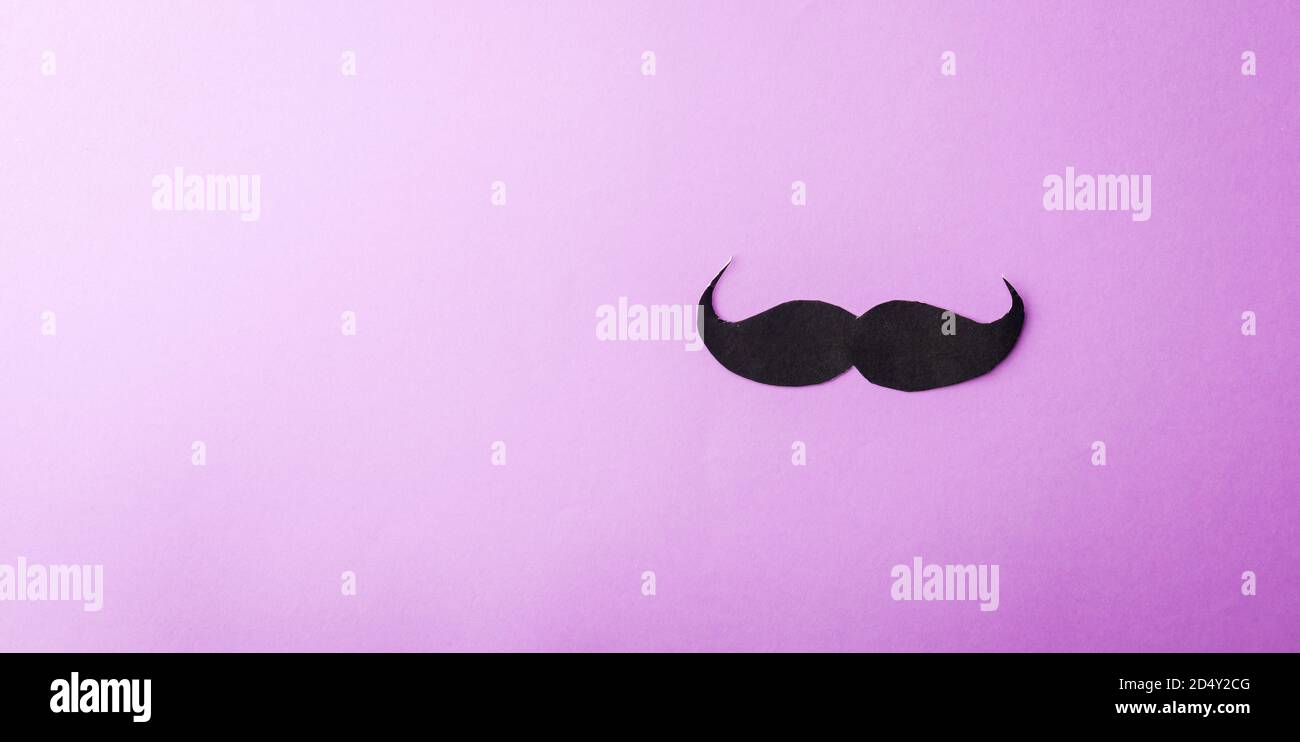 Black mustache paper, studio shot isolated on purple background ...