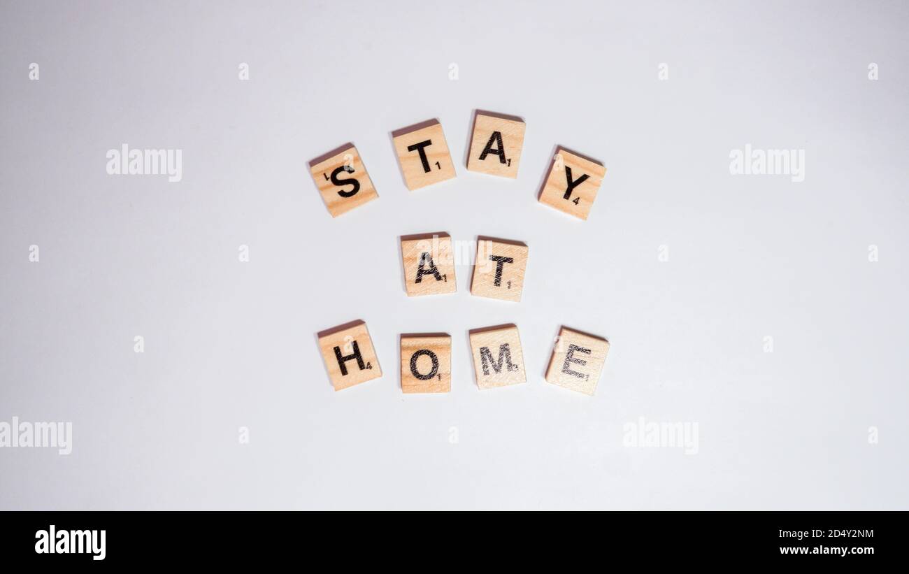 STAY HOME word text on white background Stock Photo - Alamy