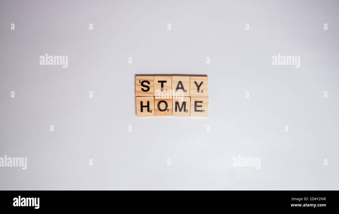 STAY HOME word text on white background Stock Photo - Alamy