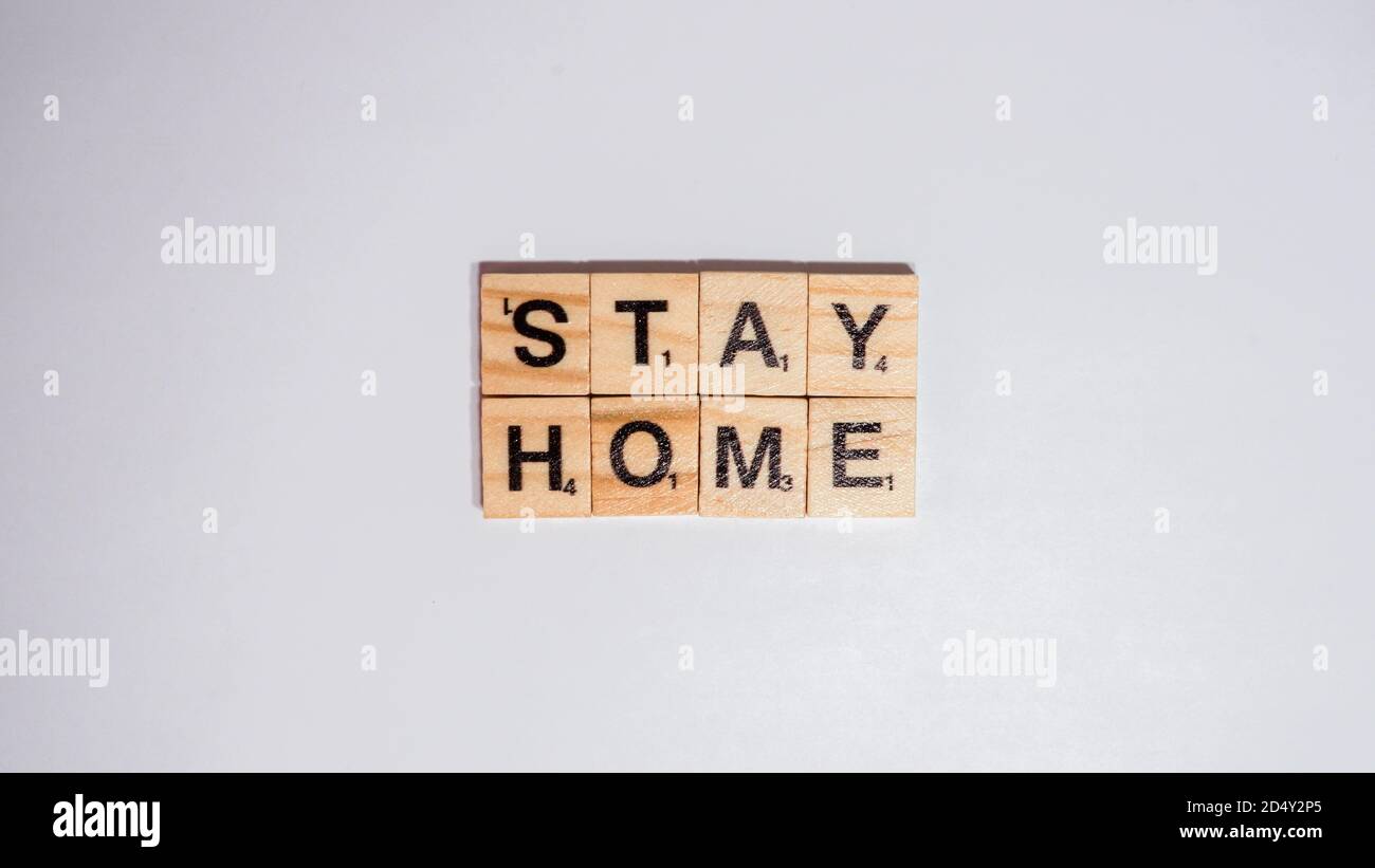 STAY HOME word text on white background Stock Photo - Alamy