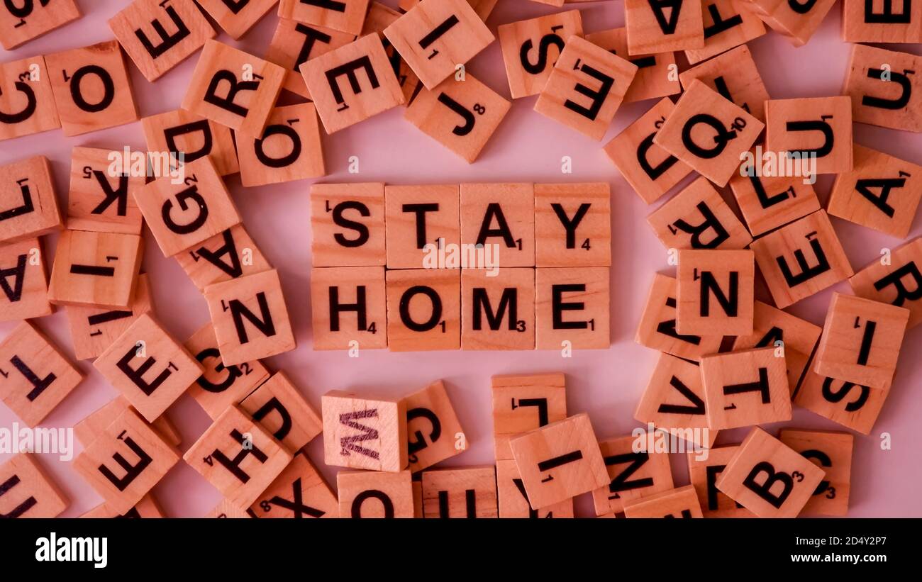 STAY HOME word text on white background Stock Photo - Alamy
