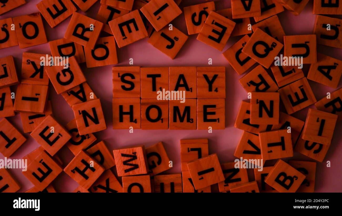 STAY HOME word text on white background Stock Photo - Alamy