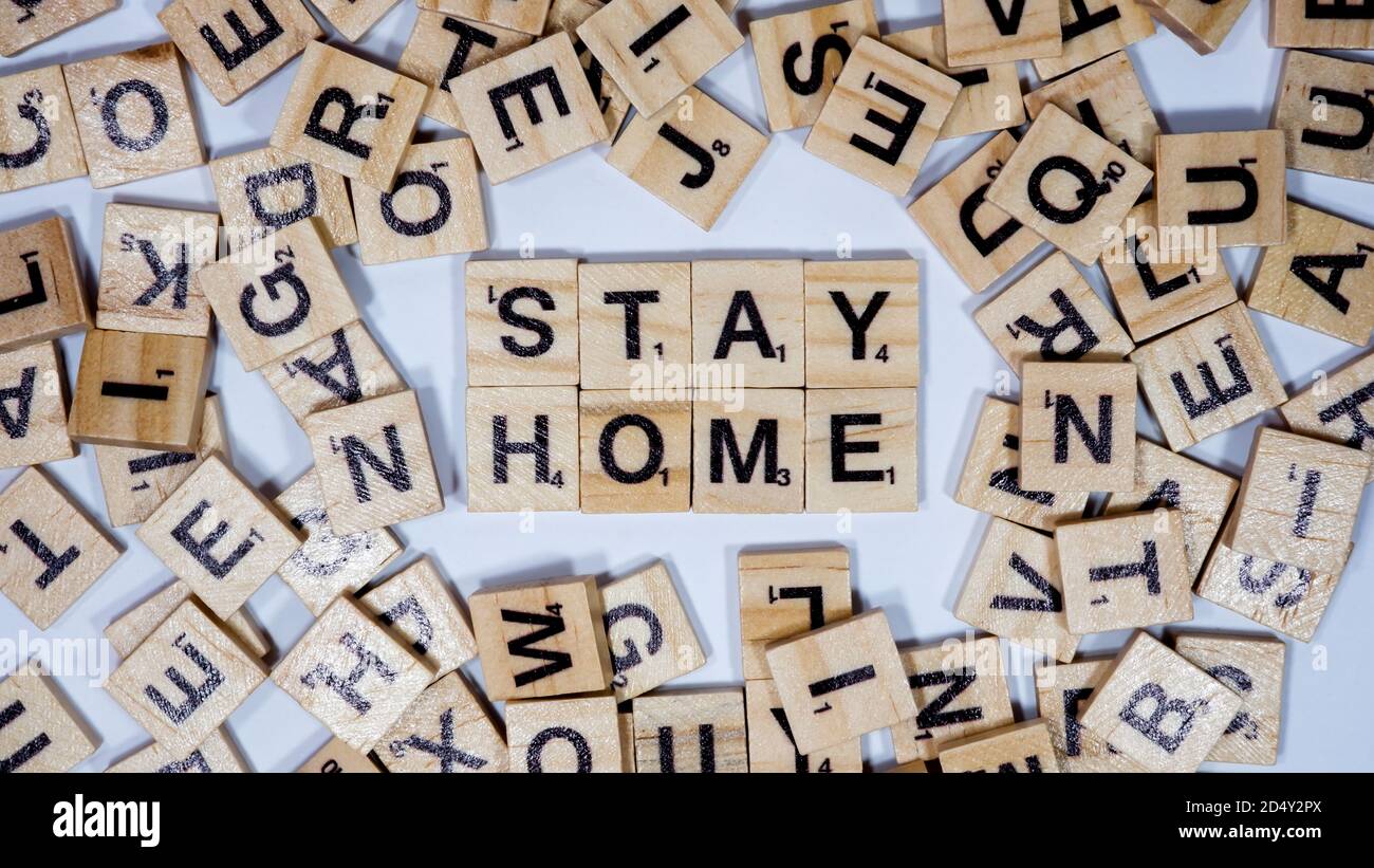 STAY HOME word text on white background Stock Photo - Alamy