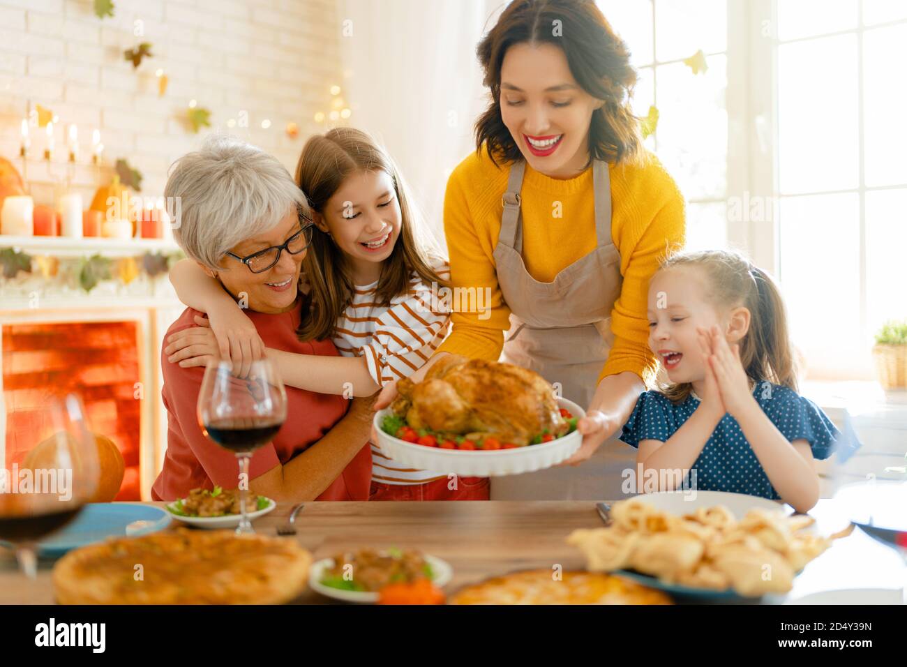 Happy Thanksgiving Day! Autumn feast. Family sitting at the table and ...