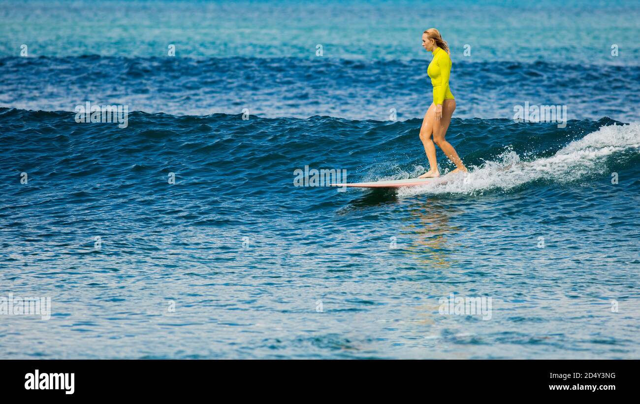 Female longboard surfing hi-res stock photography and images - Alamy