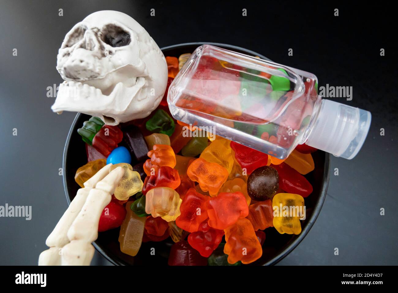 Skeleton Claw hands with Candy and Hand Sanitizer - Halloween Concept ...
