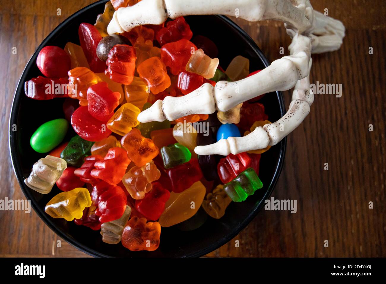 Skeleton Claw hands with Candy and Hand Sanitizer - Halloween Concept ...