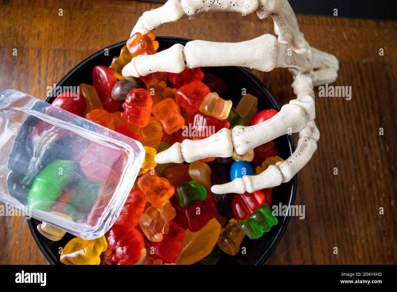 Skeleton Claw hands with Candy and Hand Sanitizer - Halloween Concept ...