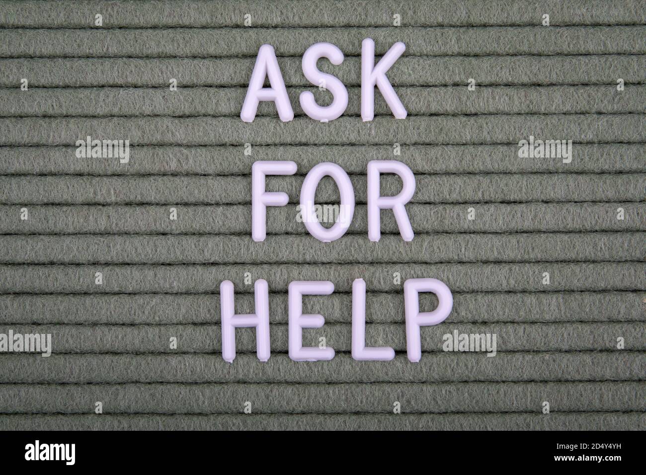 ASK FOR HELP. White letters of the alphabet on a green background. Text ...