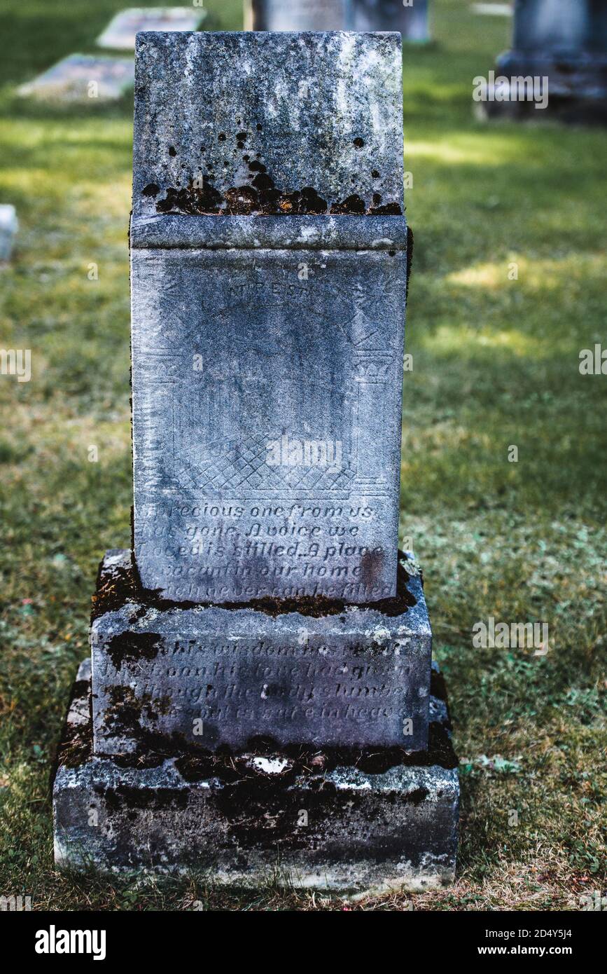 Old stone tombstone in a cemetery Stock Photo - Alamy