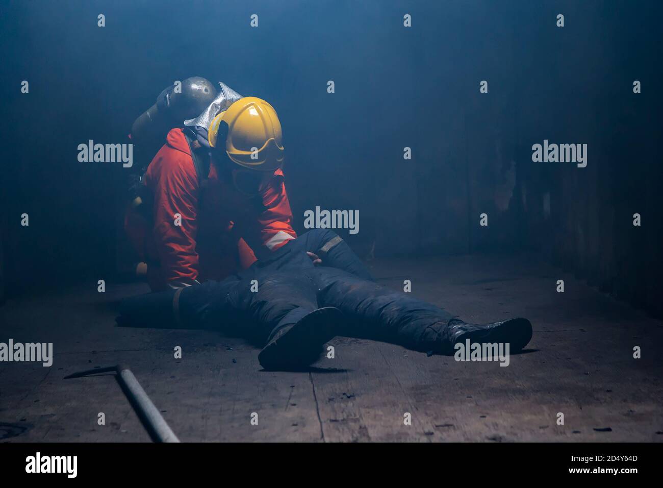 Firefighter help people in the burning warehouse / Fire and rescue ...