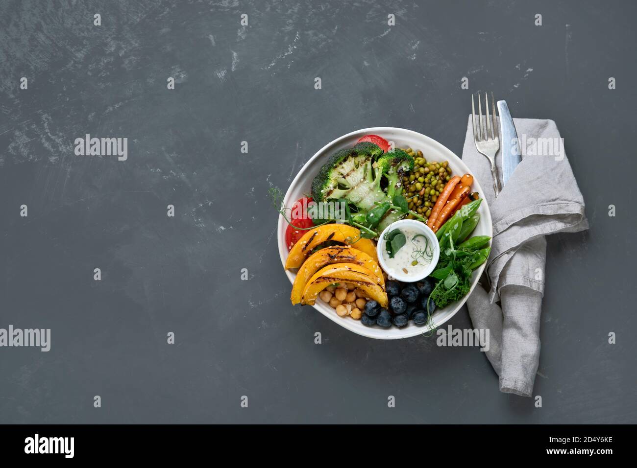 Buddha bowl of mixed grilled vegetables and legumes. Healthy eating concept. Top view, copy ...