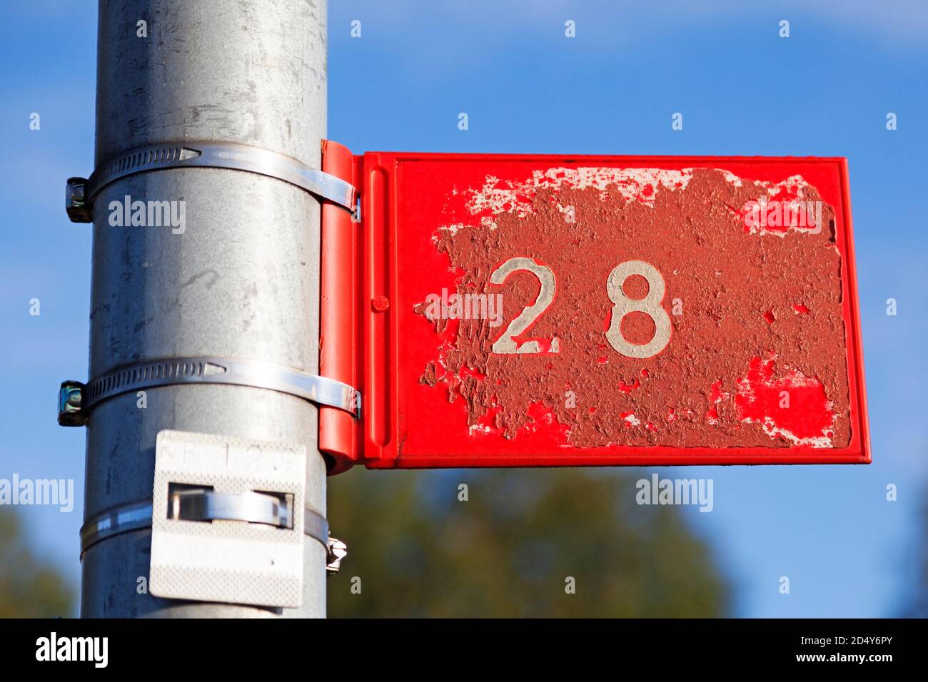 red sign with white text number twenty-eight Stock Photo - Alamy