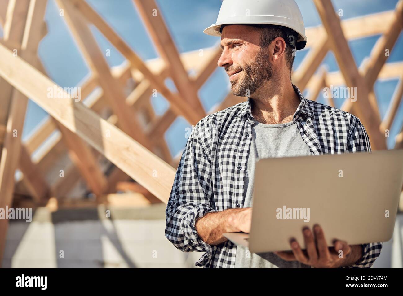 Busy field engineer controlling the process of house construction Stock ...
