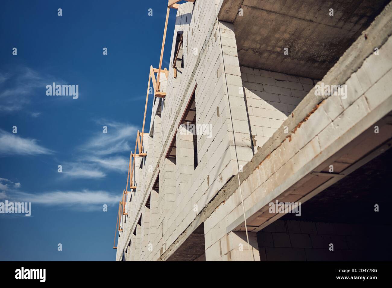 New building made of white bricks in the making Stock Photo - Alamy