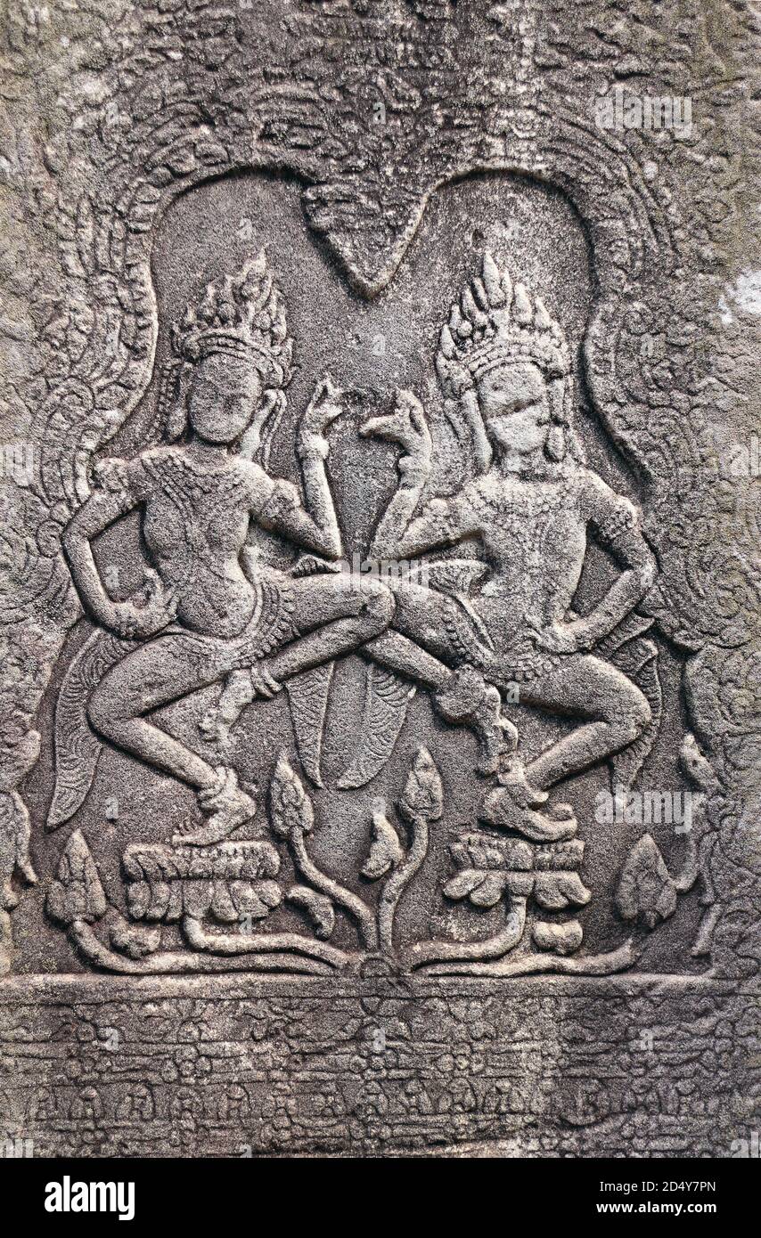 Wall carving with two womans dancers apsara, famous Angkor Wat complex ...