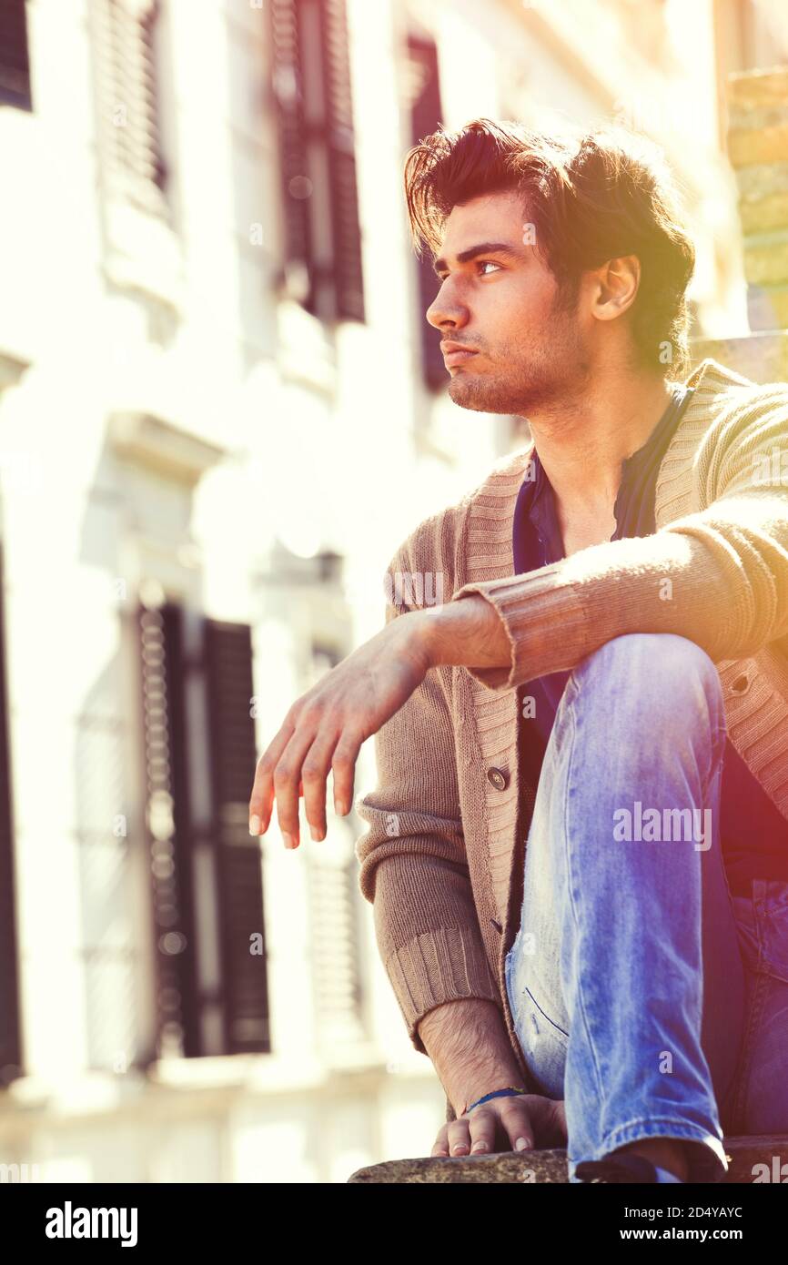 Male model sitting wall hi-res stock photography and images - Alamy