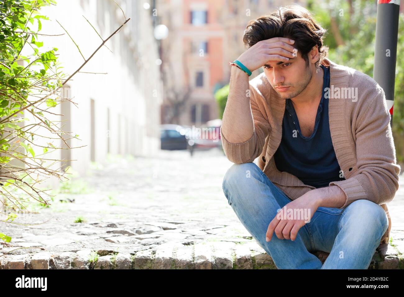 Anxiety. Thoughtful young man anxious, outdoors. A young and handsome ...