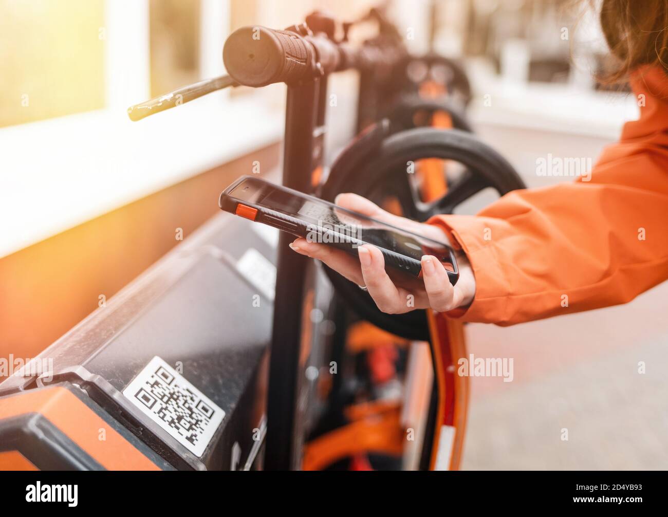 ECO-friendly vehicle.A person holds a smartphone in his hands and reads ...