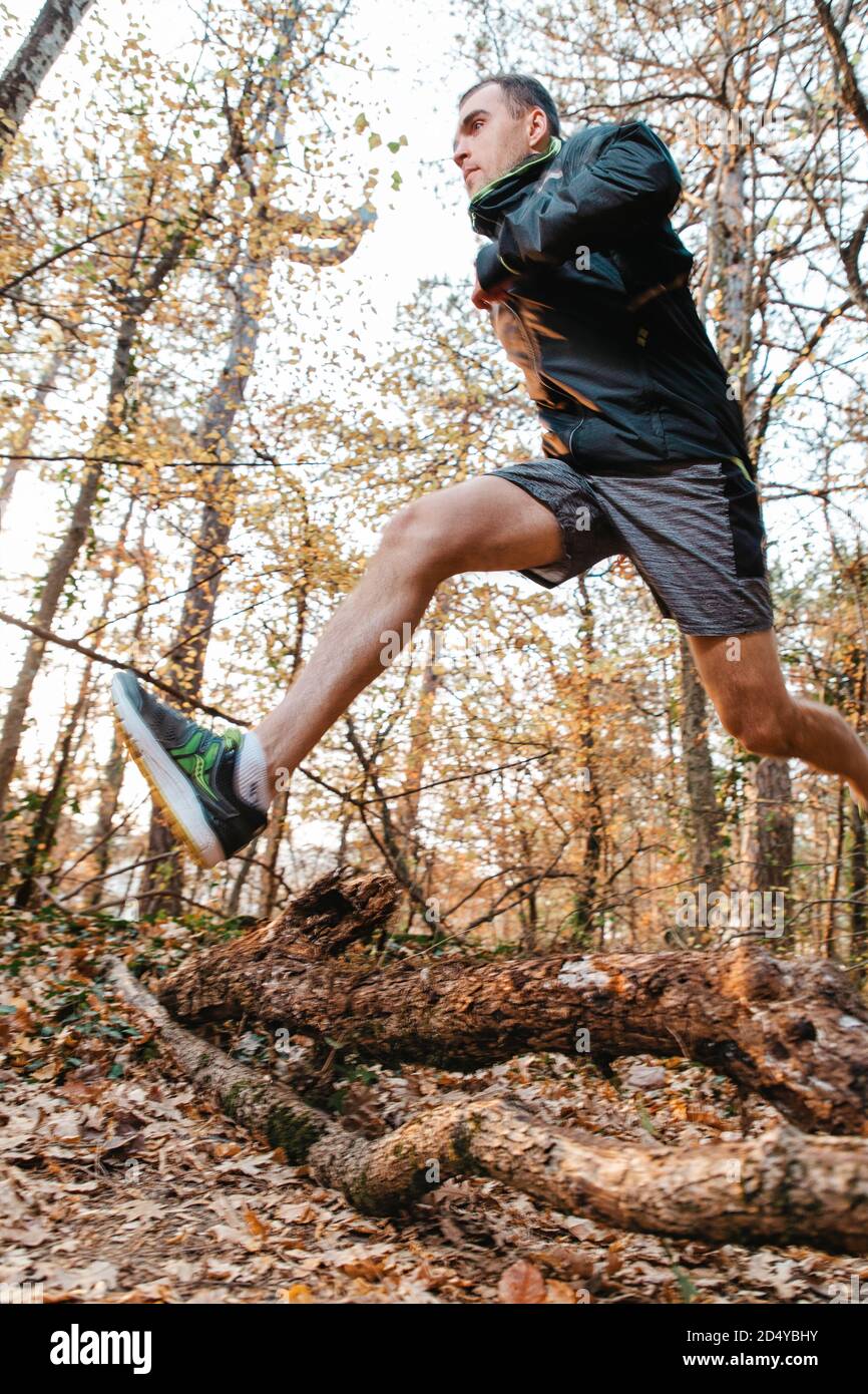 The concept of sports and cross-country running. A man in sportswear ...