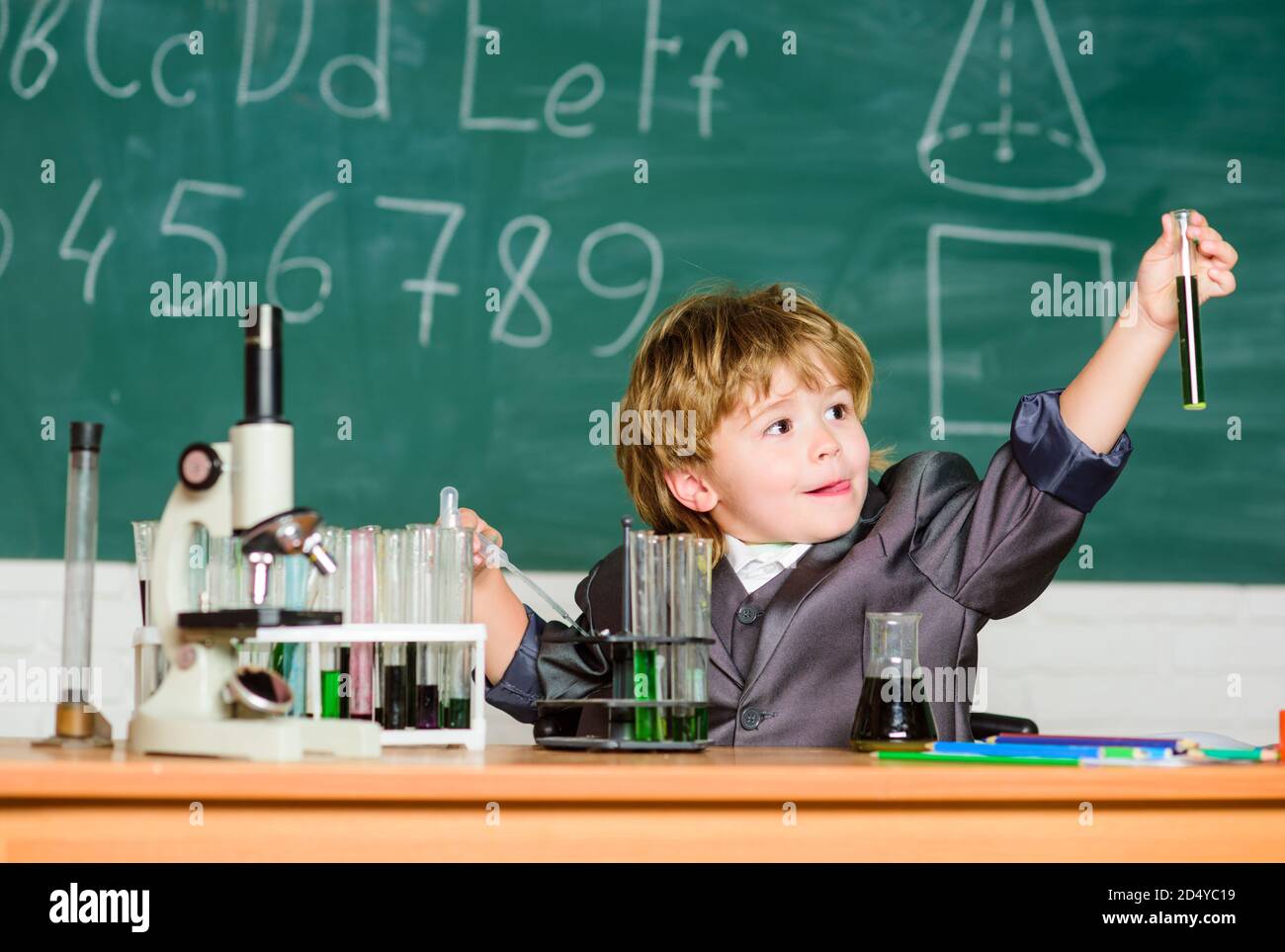 Back to school. Pupil looking through microscope . student do science ...