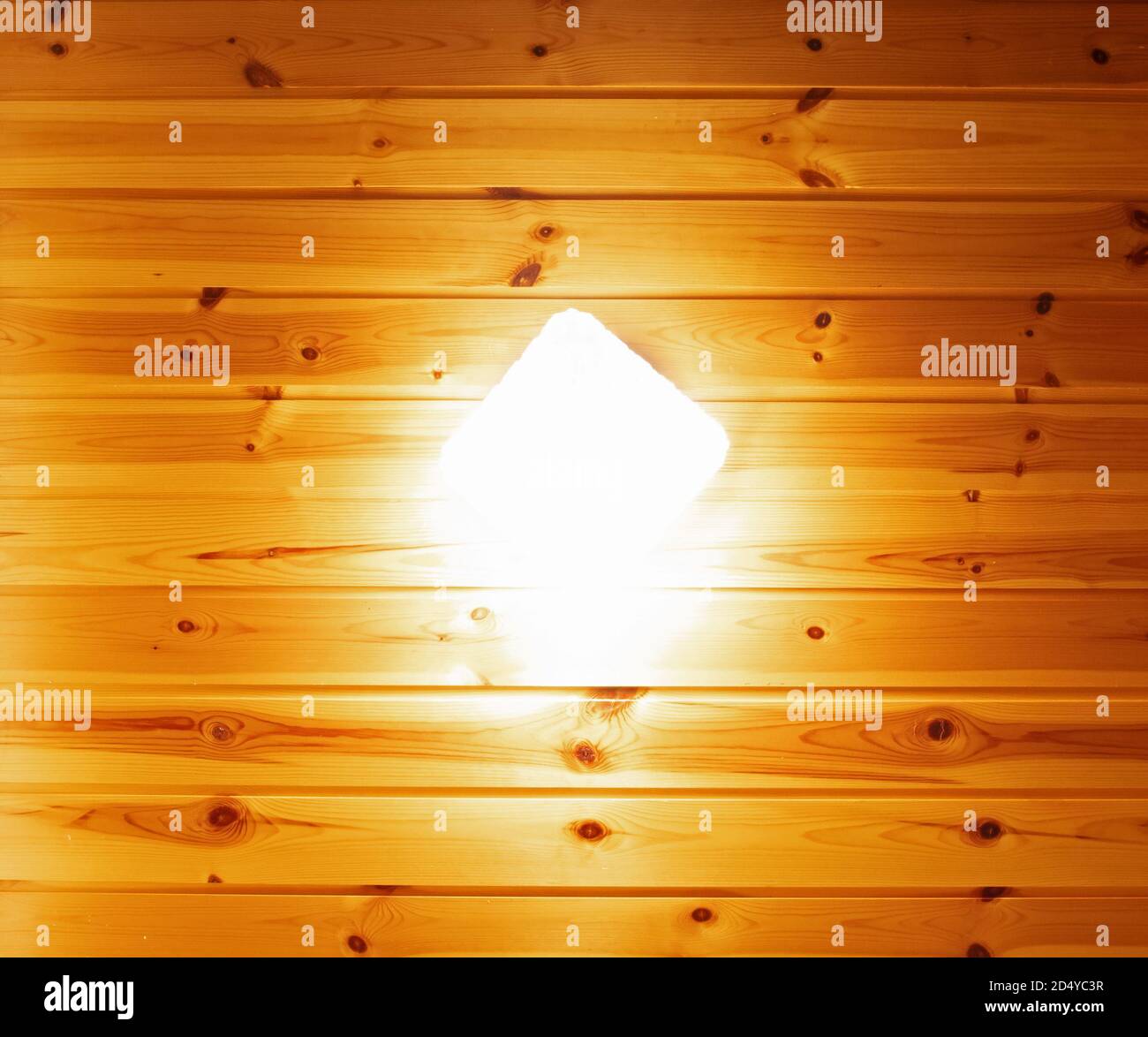Light shining bright on a wooden ceiling Stock Photo - Alamy