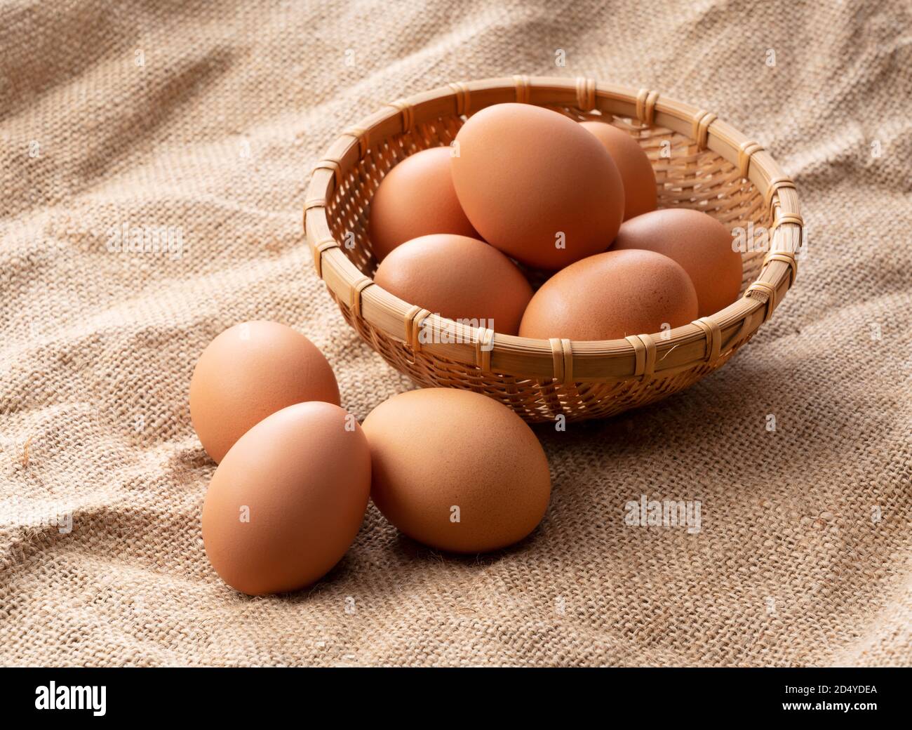 the egg on the burlap cloth and the egg in a colander were photographed ...