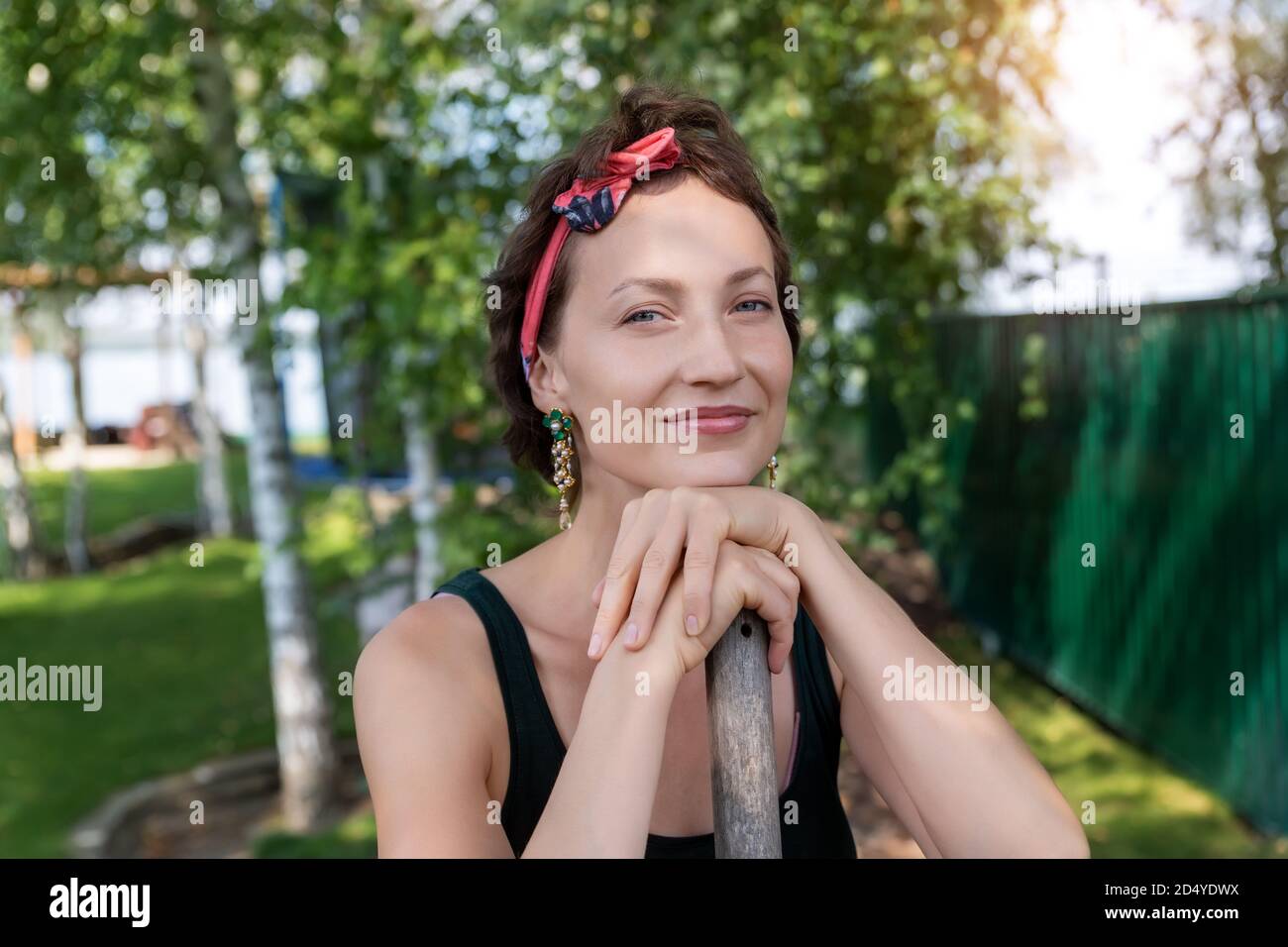 Happy Female Farmer Holding Shovel High Resolution Stock Photography ...