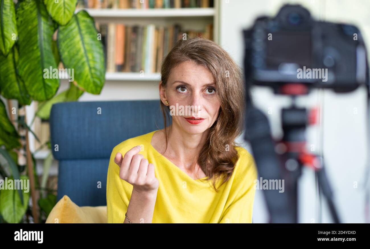 teacher or vlogger recording a lesson on camera online learning Stock ...