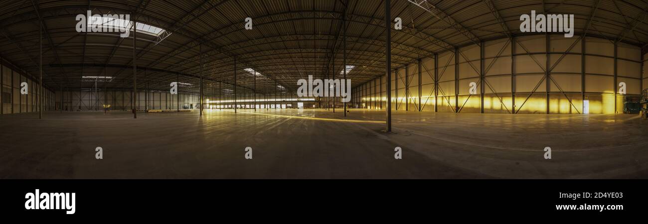 Panoramic shot of an empty warehouse Stock Photo - Alamy