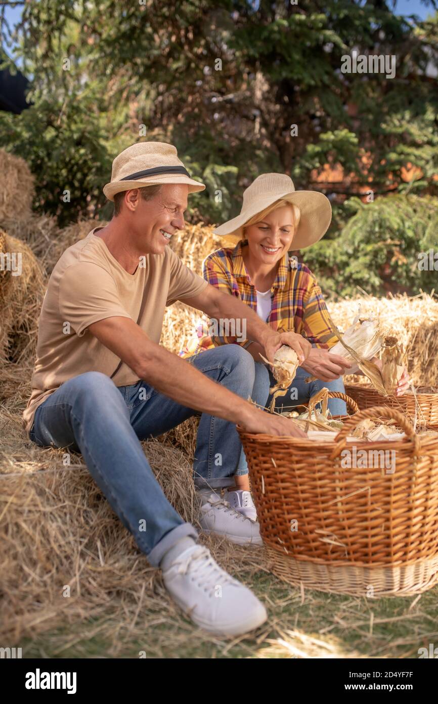 Female farmer putting hay hi-res stock photography and images - Alamy