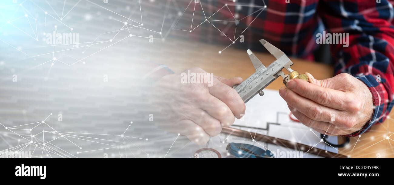 Plumber measuring a plumbing fitting with a caliper; panoramic banner ...