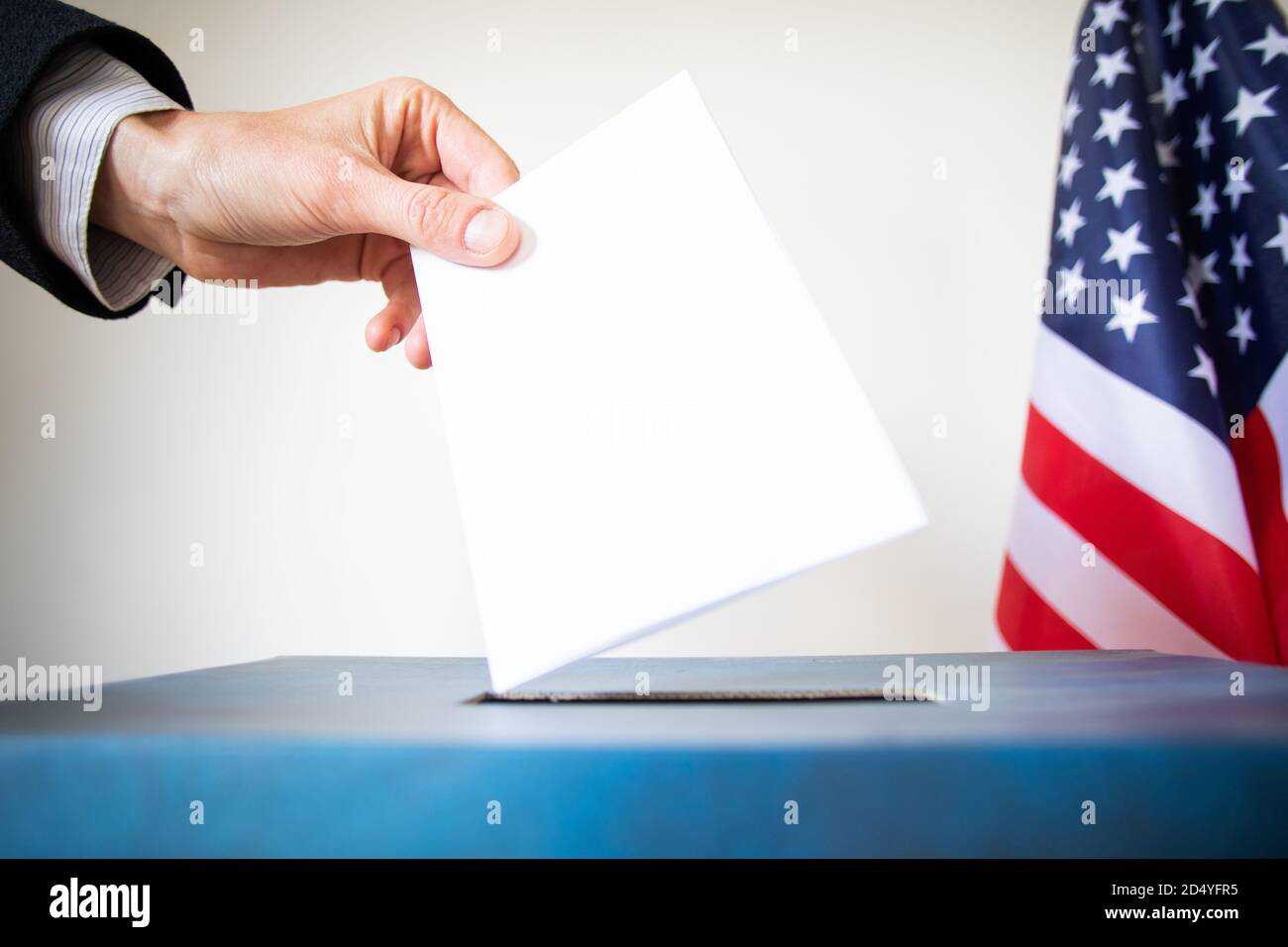 hand putting vote in ballot USA elections Stock Photo - Alamy
