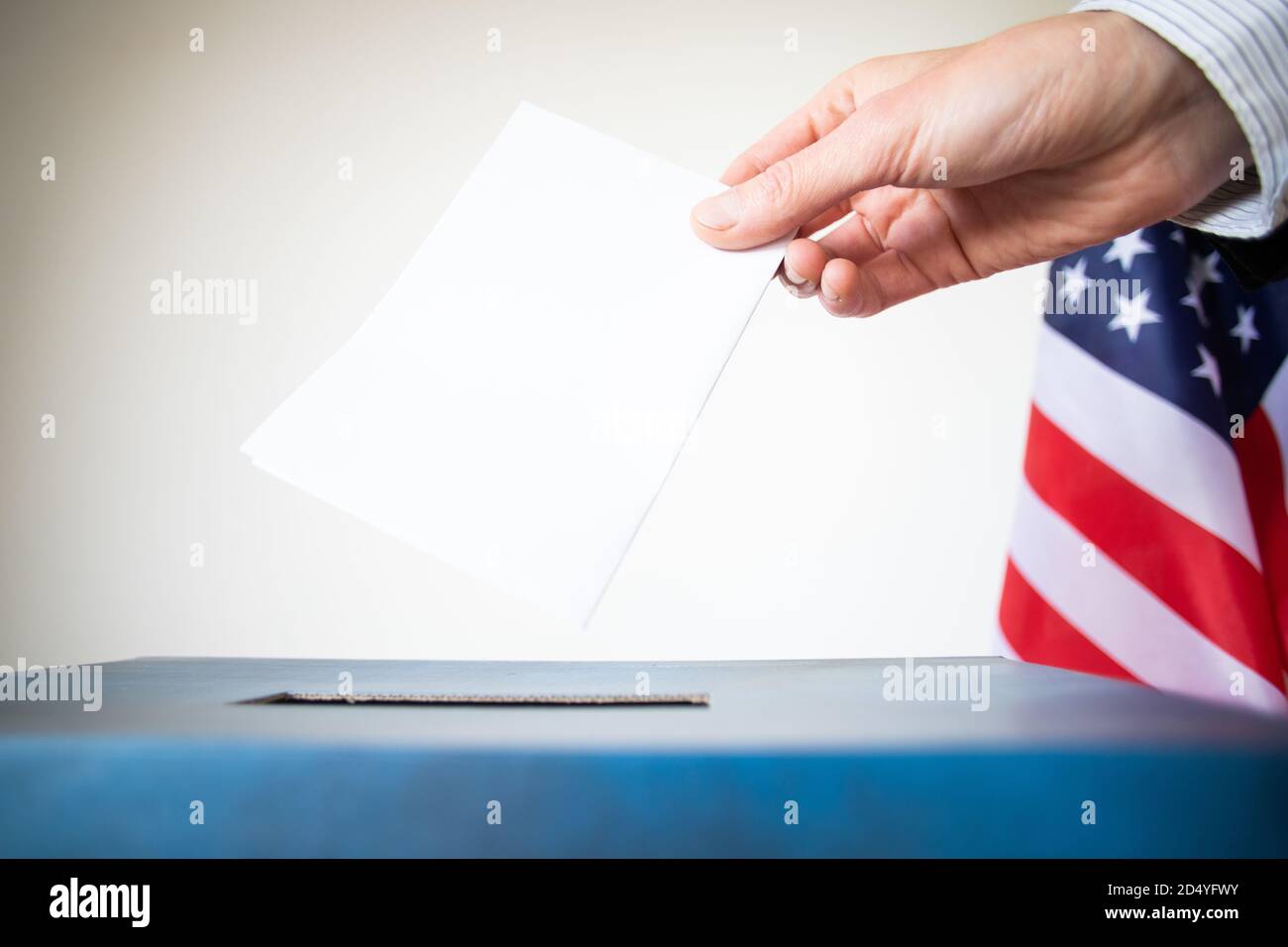 hand putting vote in ballot USA elections Stock Photo - Alamy