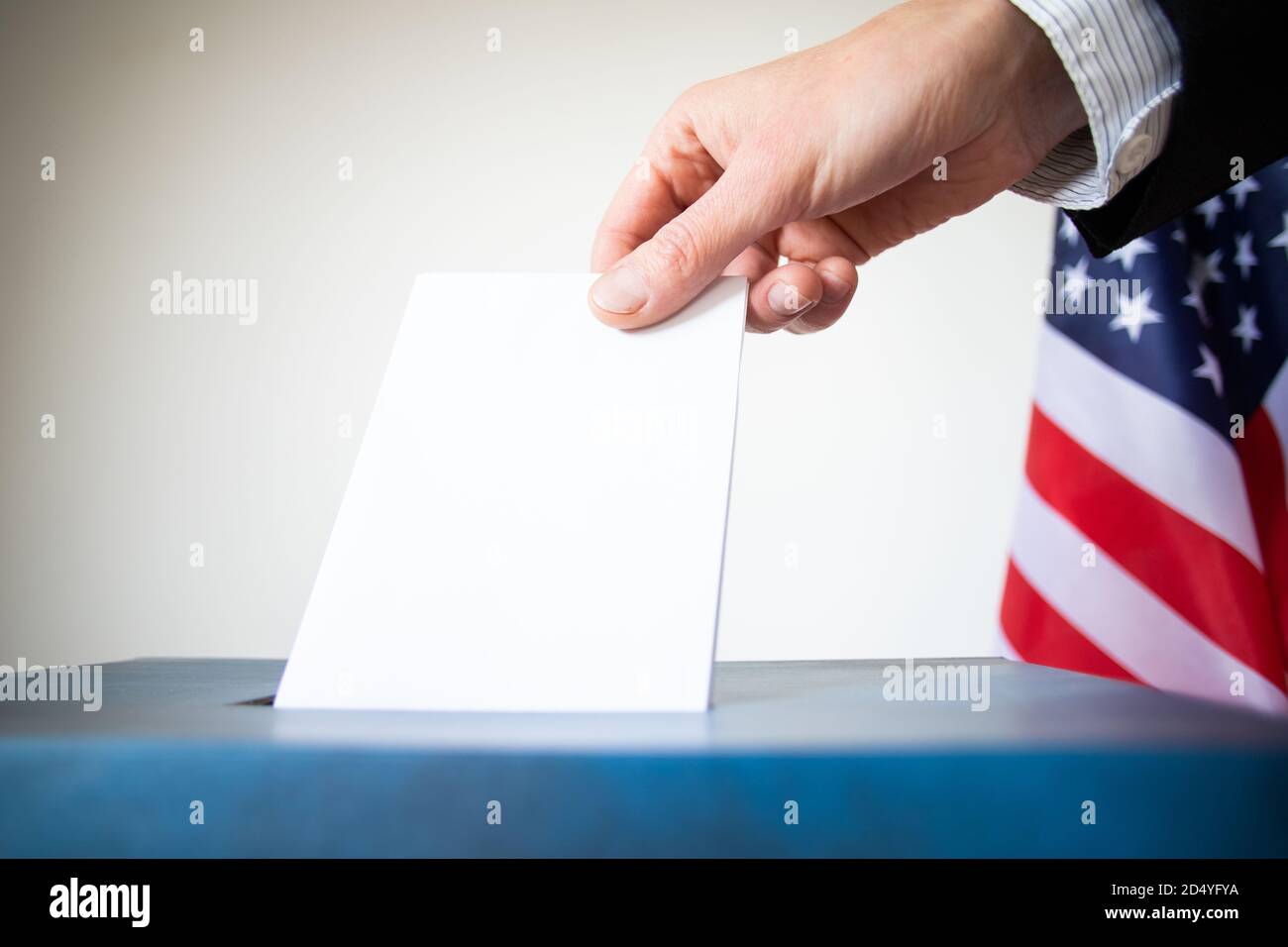 hand putting vote in ballot USA elections Stock Photo - Alamy
